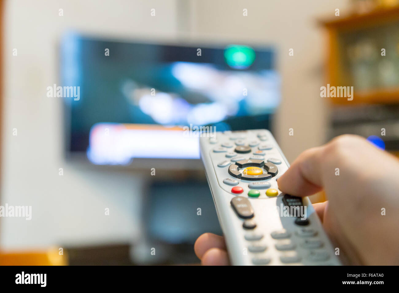 Person using remote control hi-res stock photography and images - Alamy