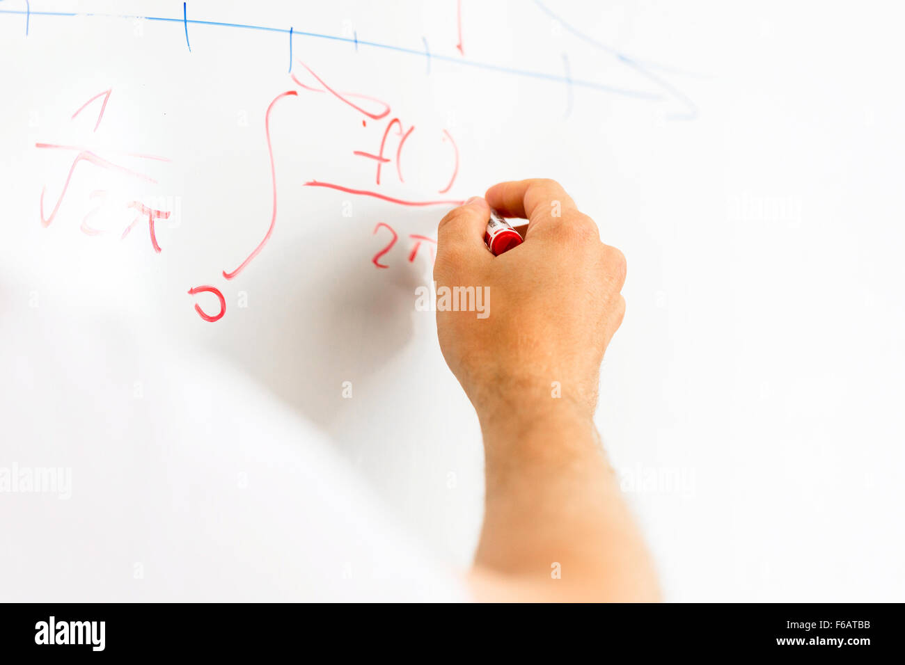 Hand with marker writing on board Stock Photo - Alamy