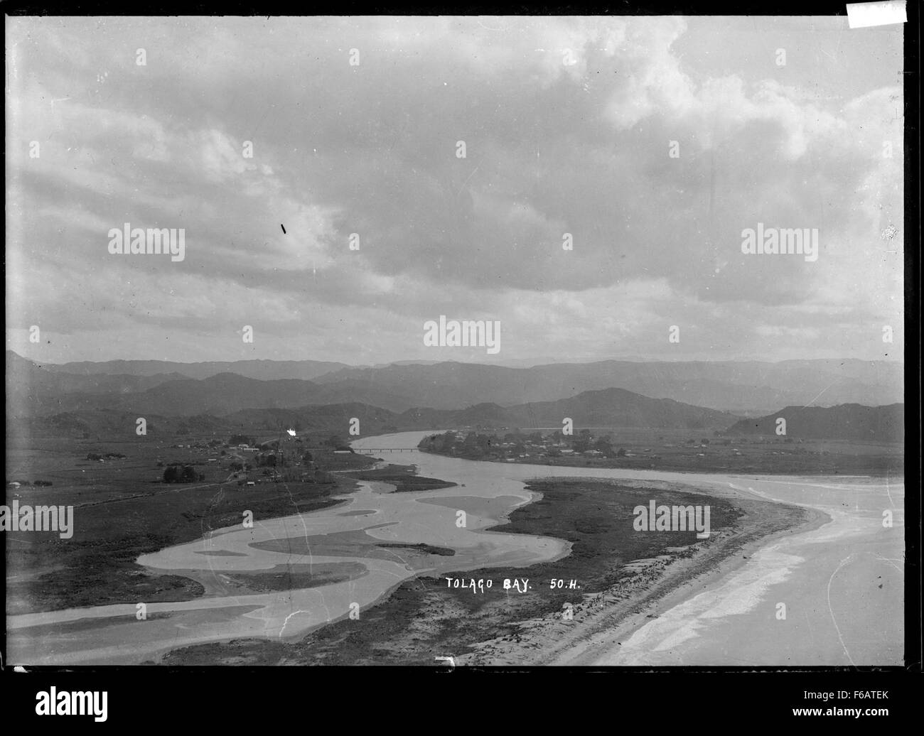 A scenic photograph of the Uawa River flowing through Tolaga Bay ...