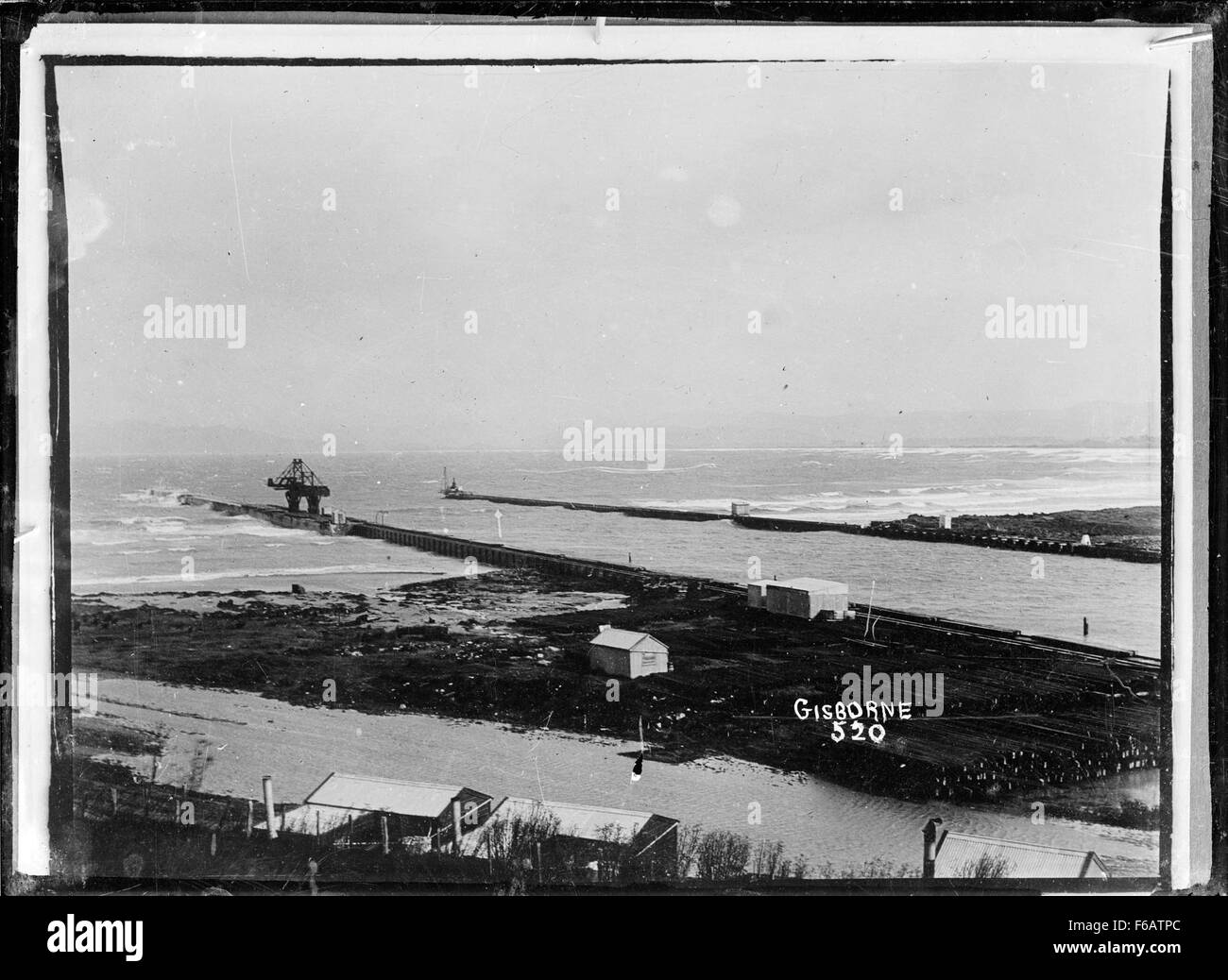 A scenic view of the breakwater at the mouth of the Turanganui River ...