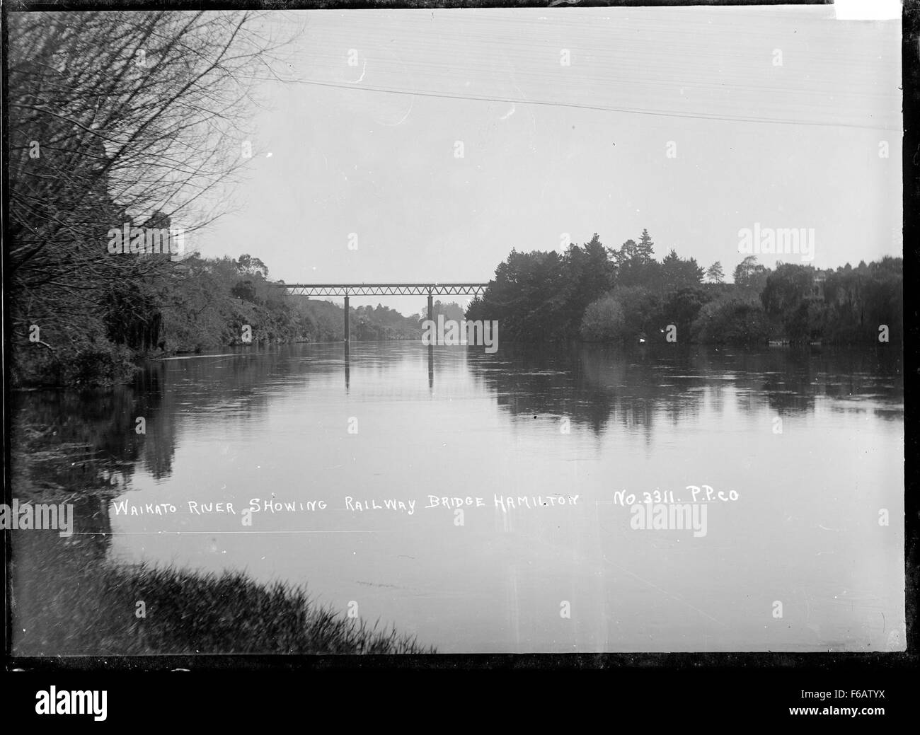 This historical photograph from the 1910s captures the railway bridge ...