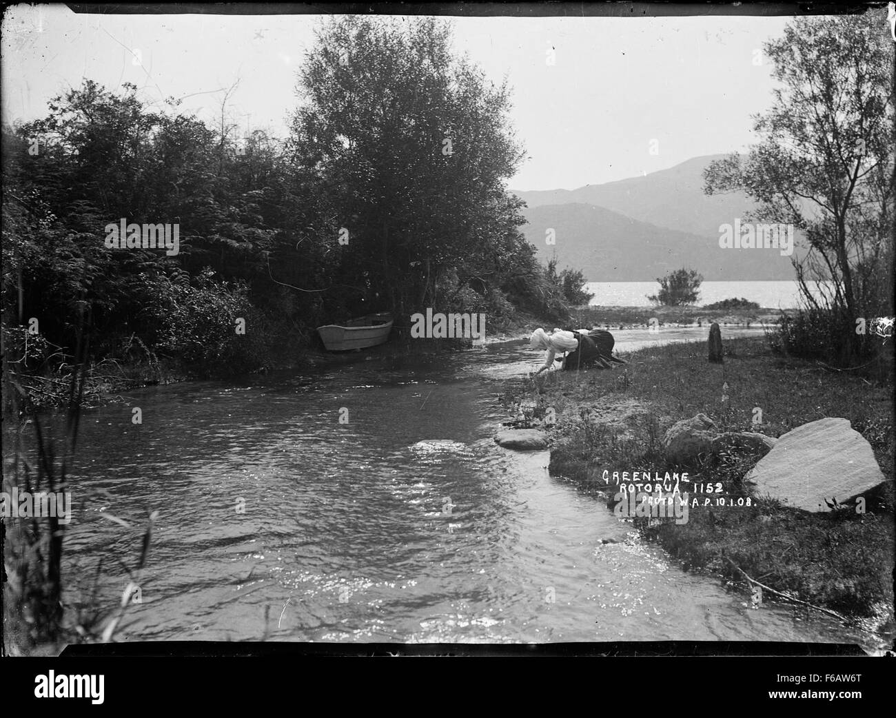 This image depicts women at Lake Rotokakahi, known for its scenic ...