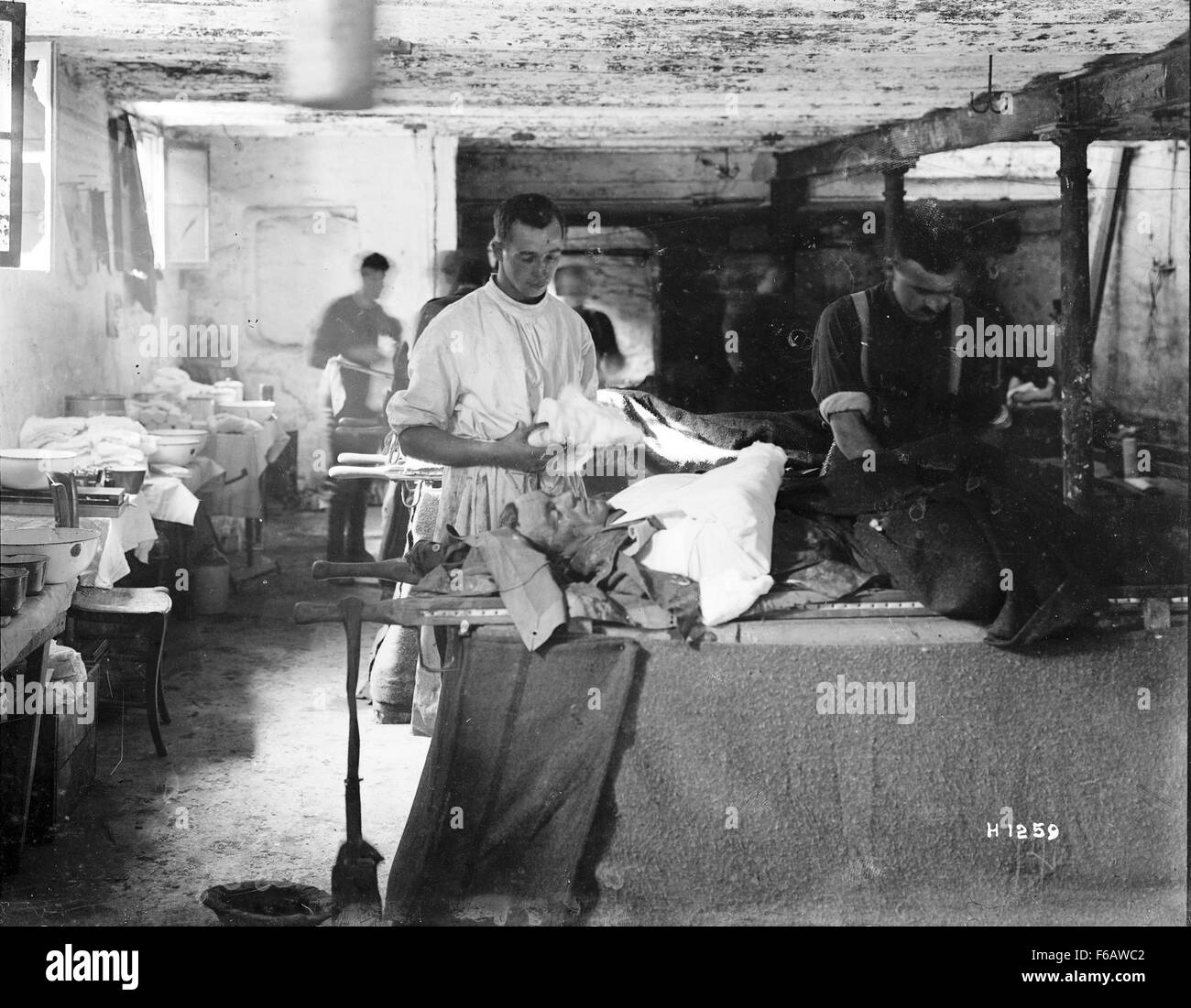 This poignant photograph from World War I shows a wounded soldier being ...
