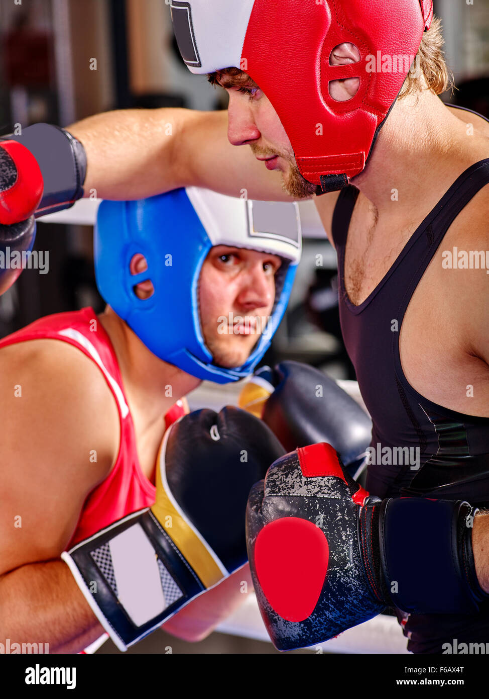 Two men boxer wearing helmet boxing Stock Photo - Alamy