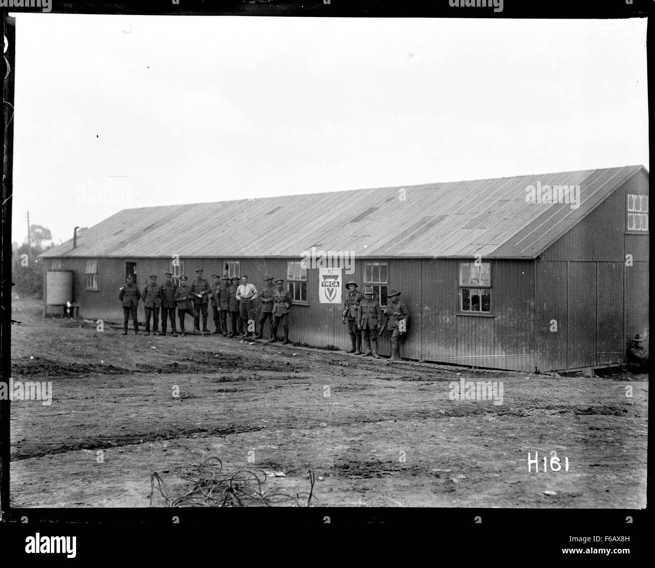 This image depicts the exterior of a YMCA hut from World War I, a ...