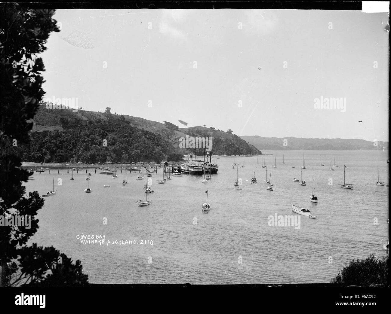 This image captures ferries docked at the wharf in Cowes Bay, Waiheke ...