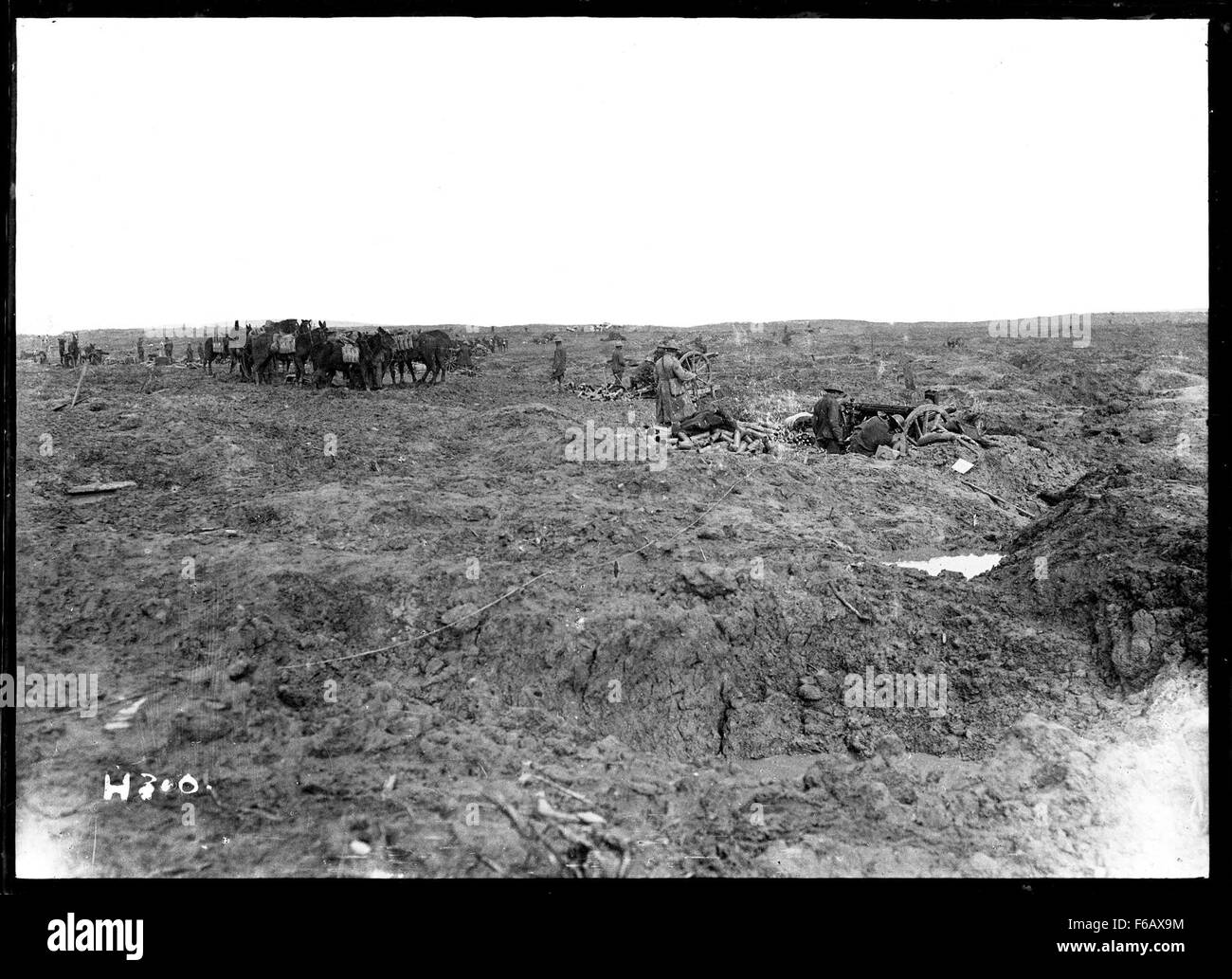 A historical photograph of field guns firing from shell holes at Kansas ...