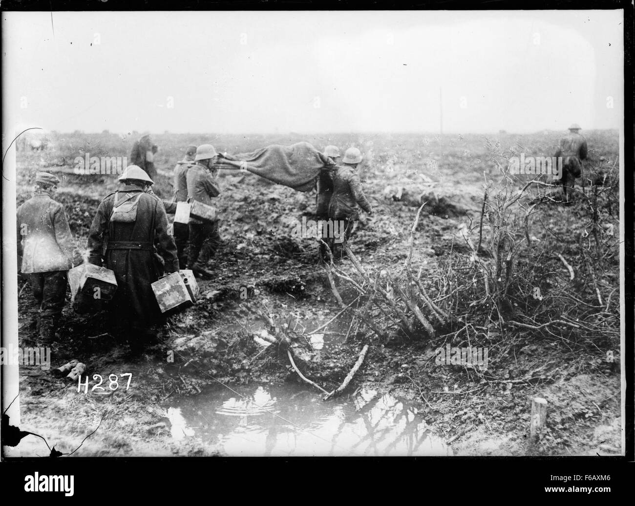 A historical image depicting German prisoners transporting wounded ...