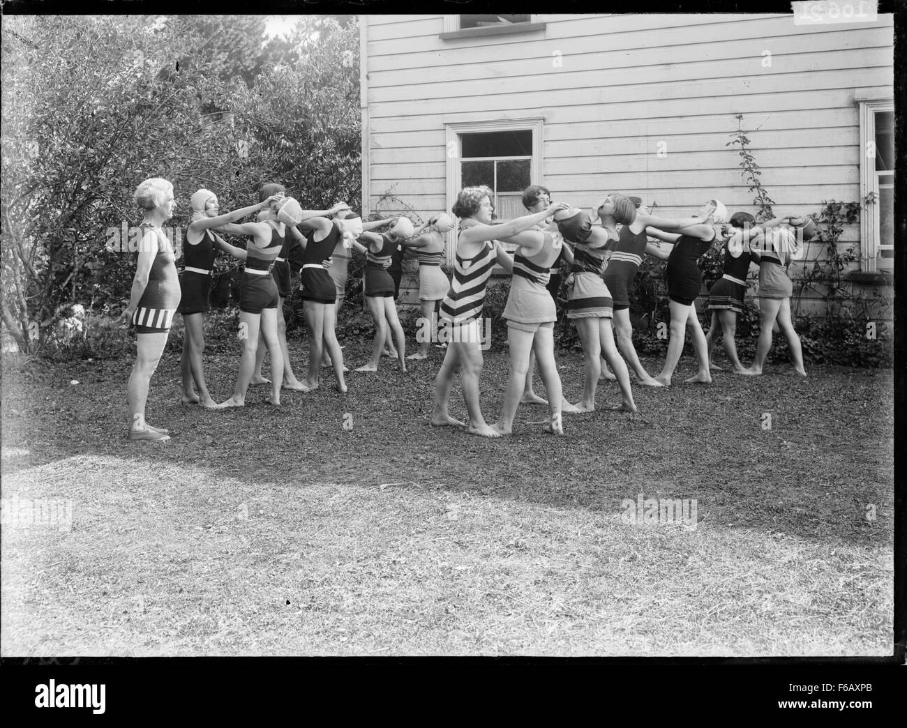 Group of girls practising a life-saving techique Stock Photo - Alamy