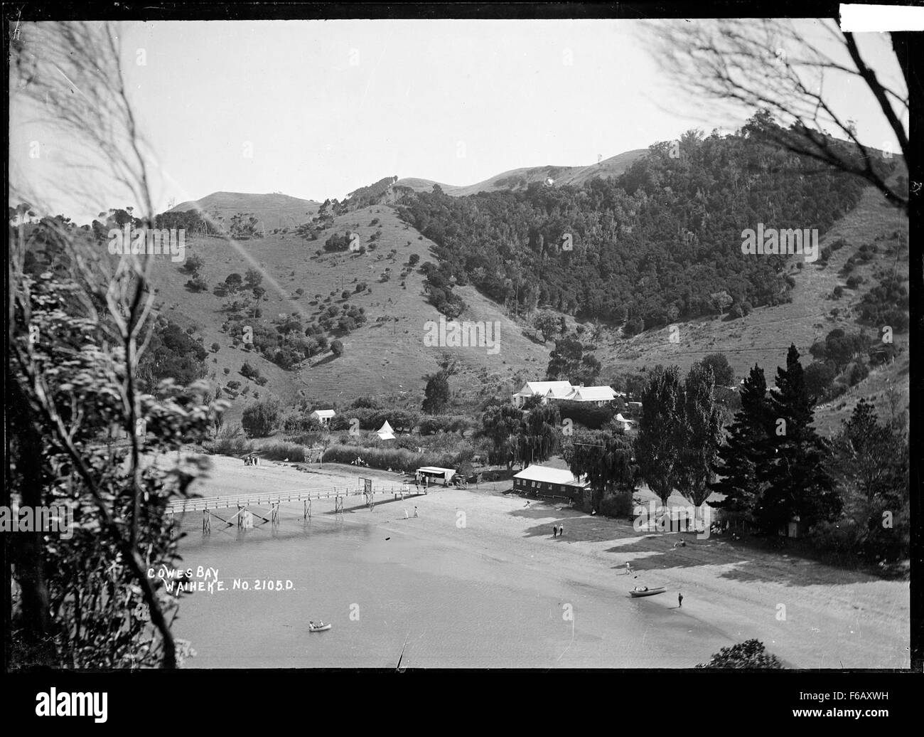This image shows the historic hotel and wharf at Cowes Bay on Waiheke ...