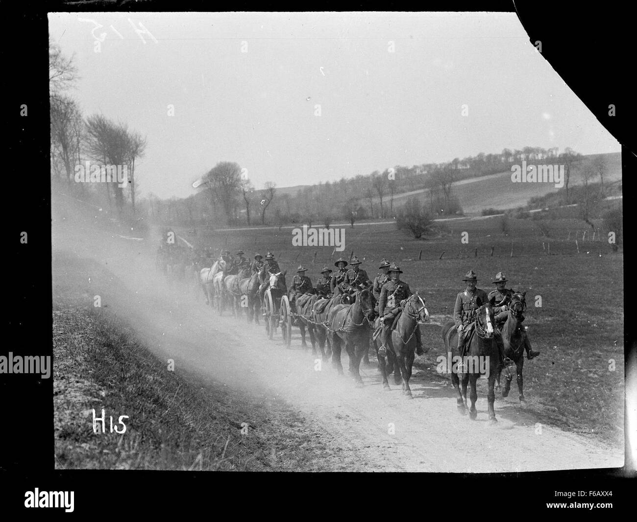 This image shows a military howitzer battery on the march, moving ...