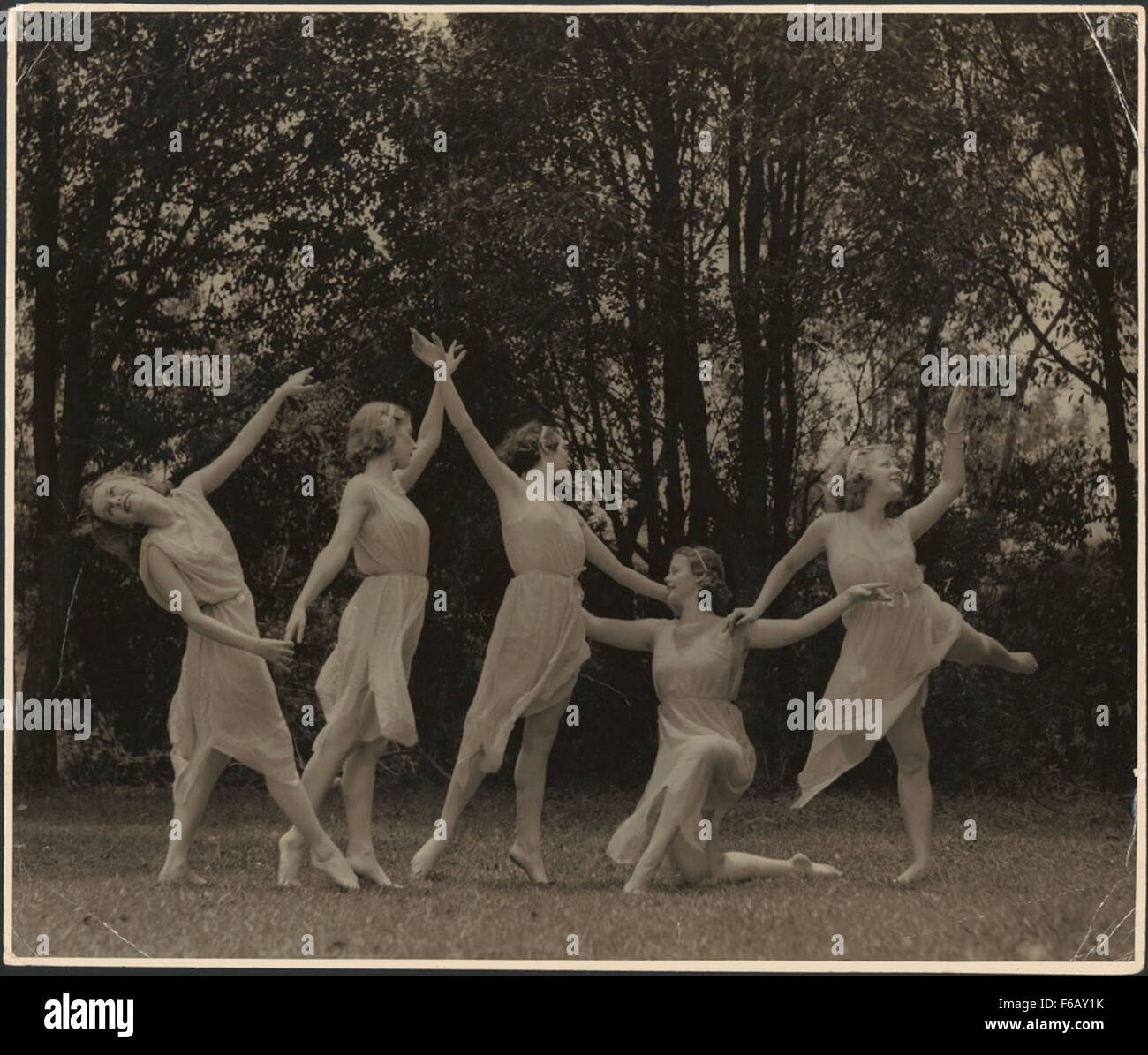 This outdoor photograph shows Moya Beaver and four other pupils in a ...