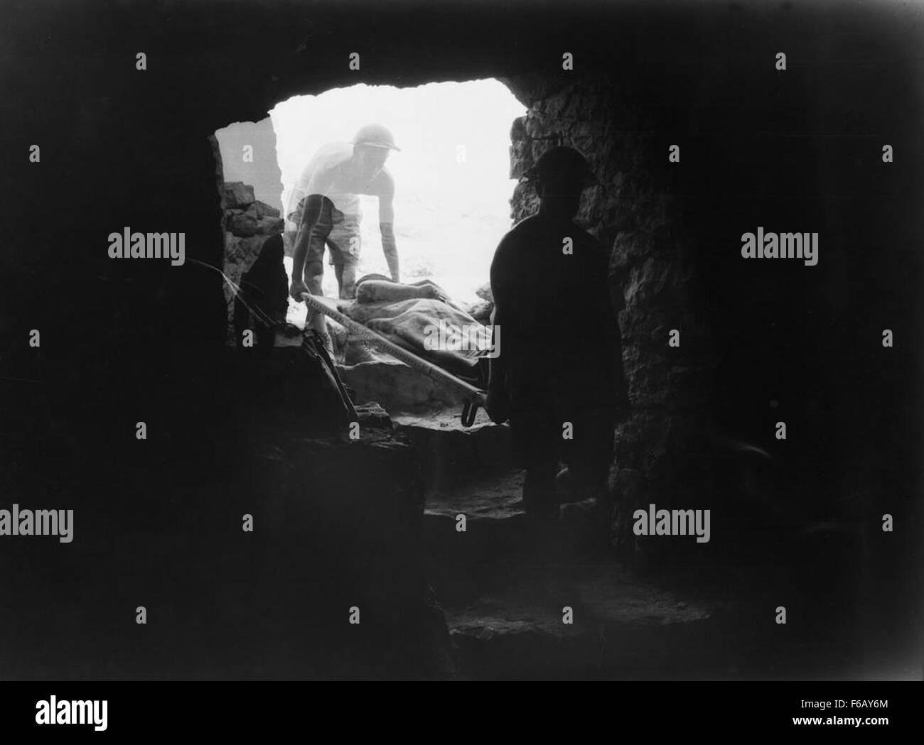This historical image captures the movement of wounded soldiers during ...