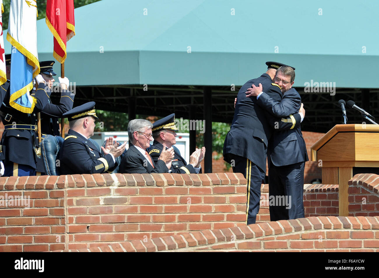 Secretary of Defense Ashton B. Carter, right, congratulates U.S. Army ...