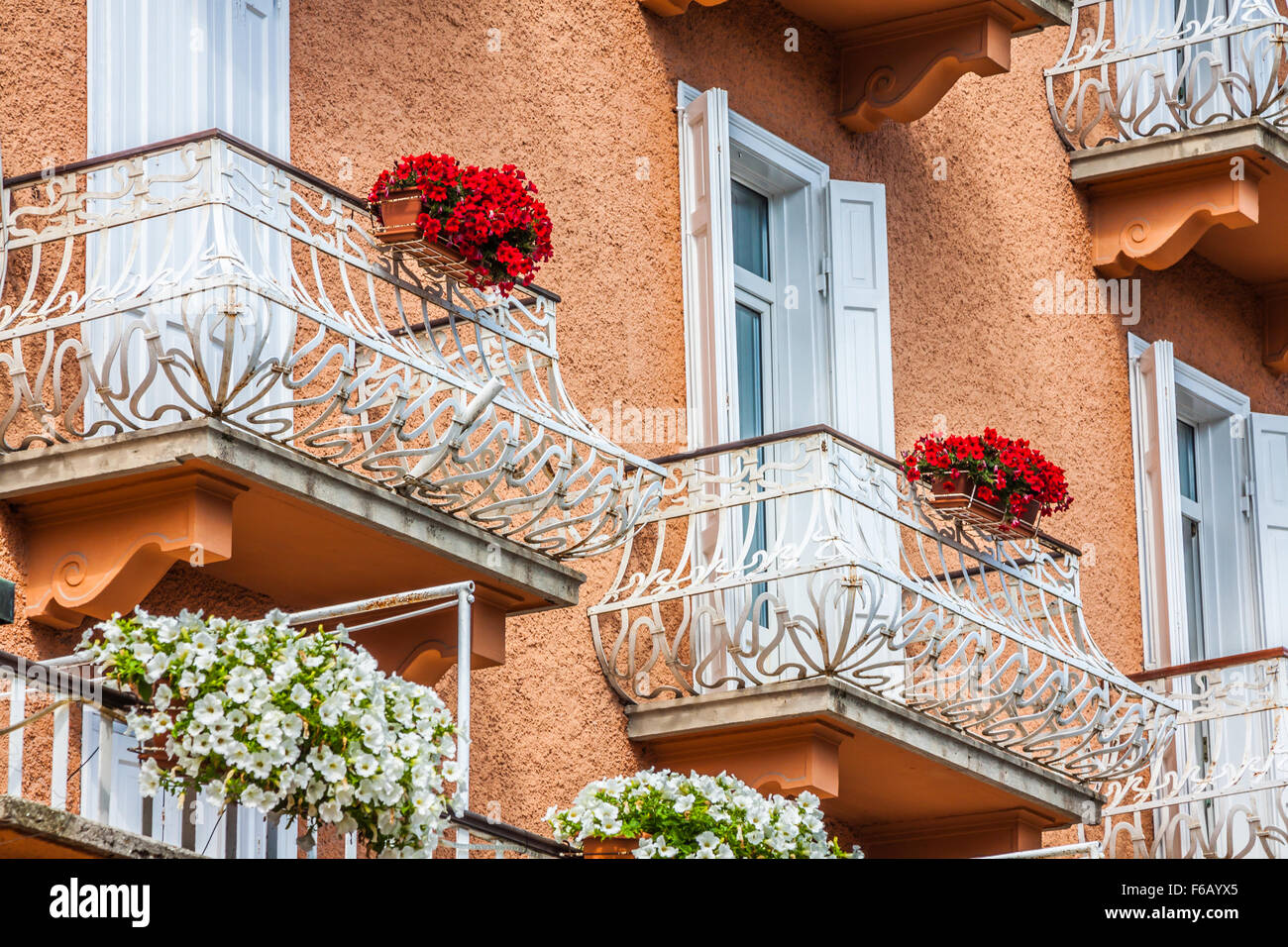 Traditional alpine houses with flowers on balcony, Cortina d'Ampezzo ...