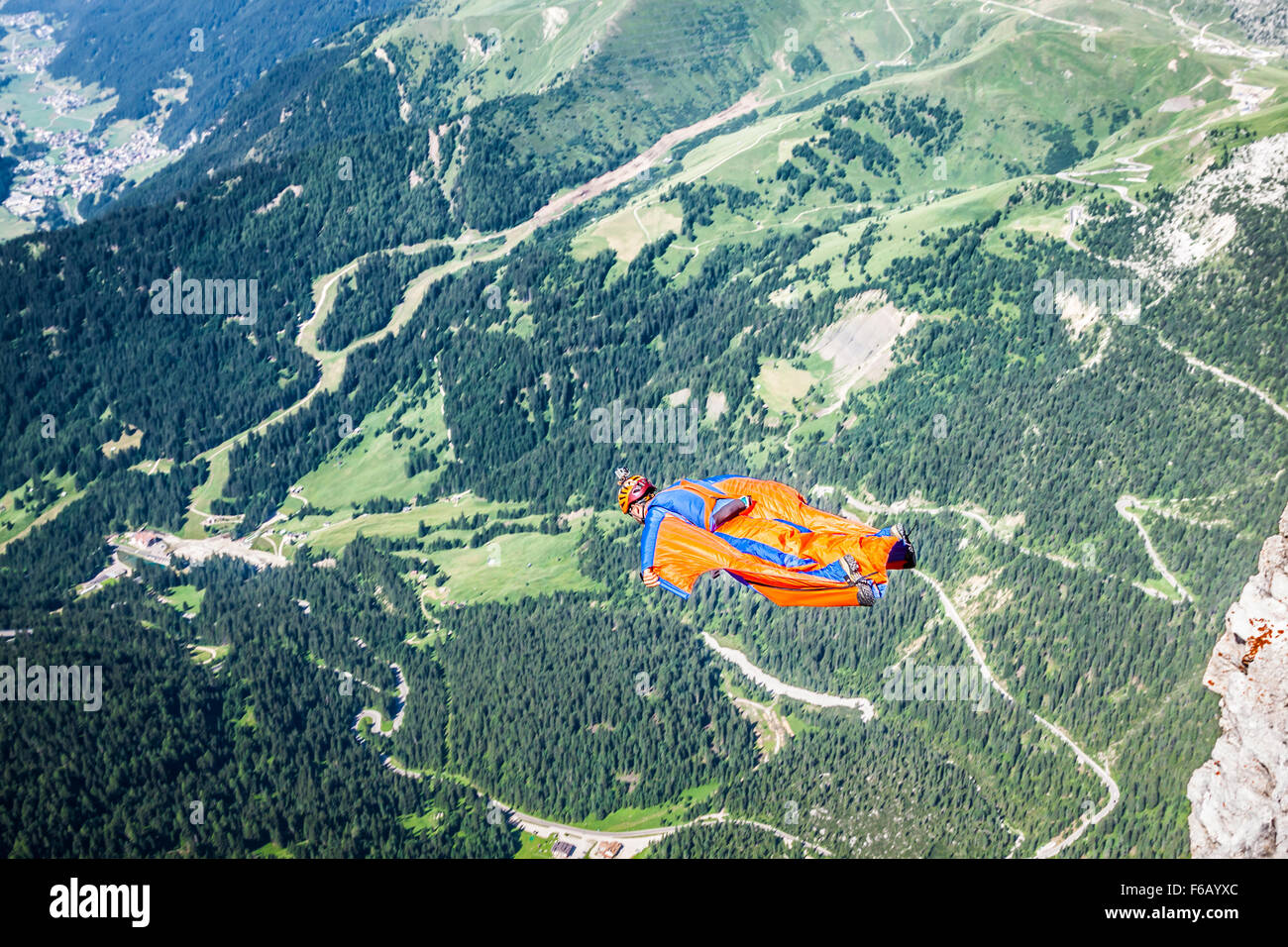 BASE jumper jumping off a big cliff in Dolomites,Italy, breathtaking ...