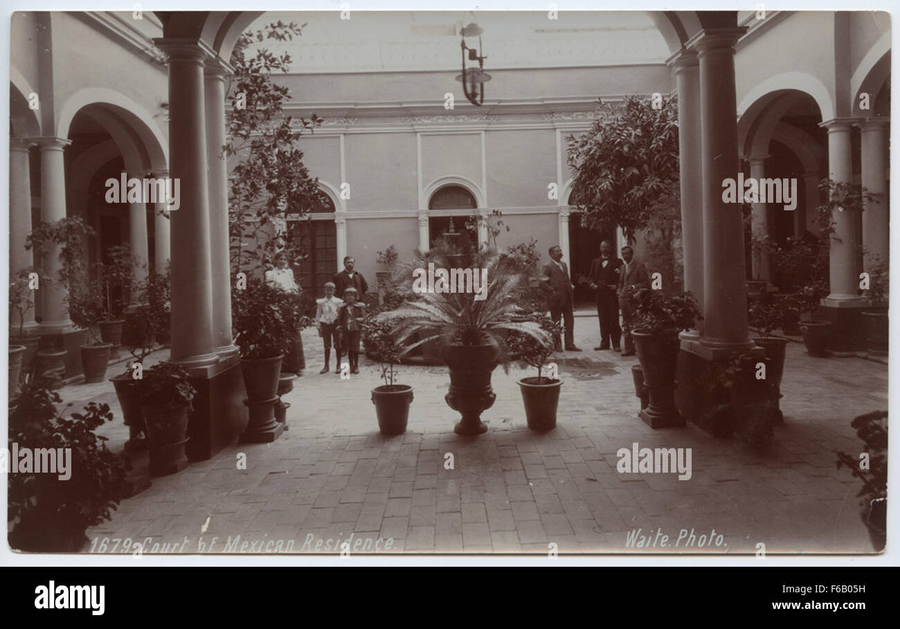 An image depicting the courtyard of a Mexican residence, showcasing a ...