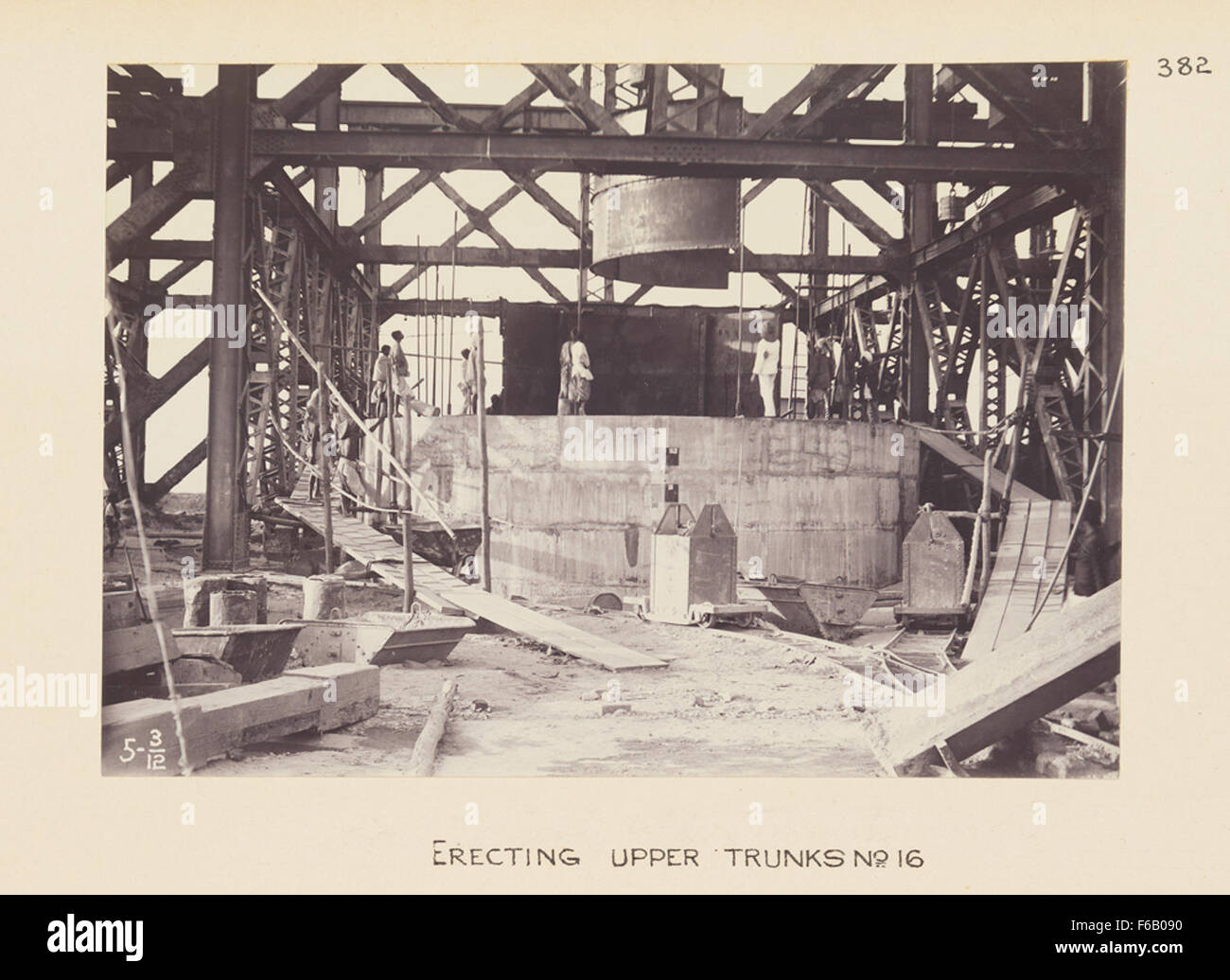 A photograph showing the construction of a railroad bridge ...