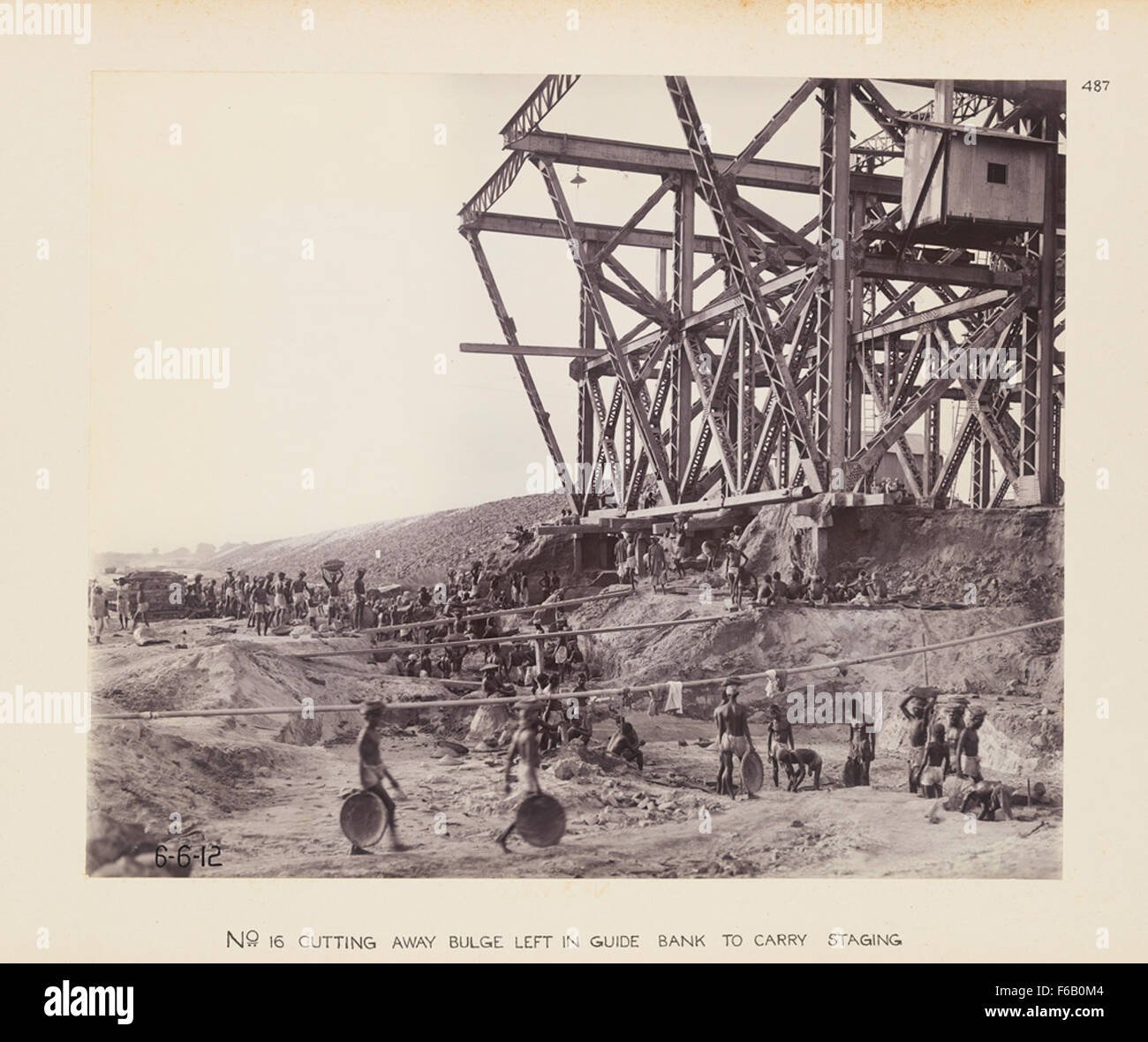 This image shows the construction of a railroad bridge, specifically ...