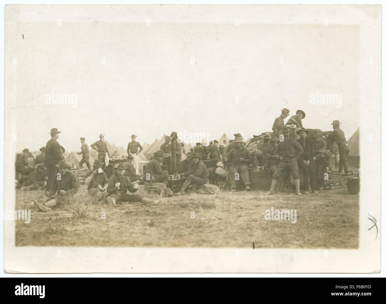 This historical photograph captures American soldiers at Fort Bliss ...