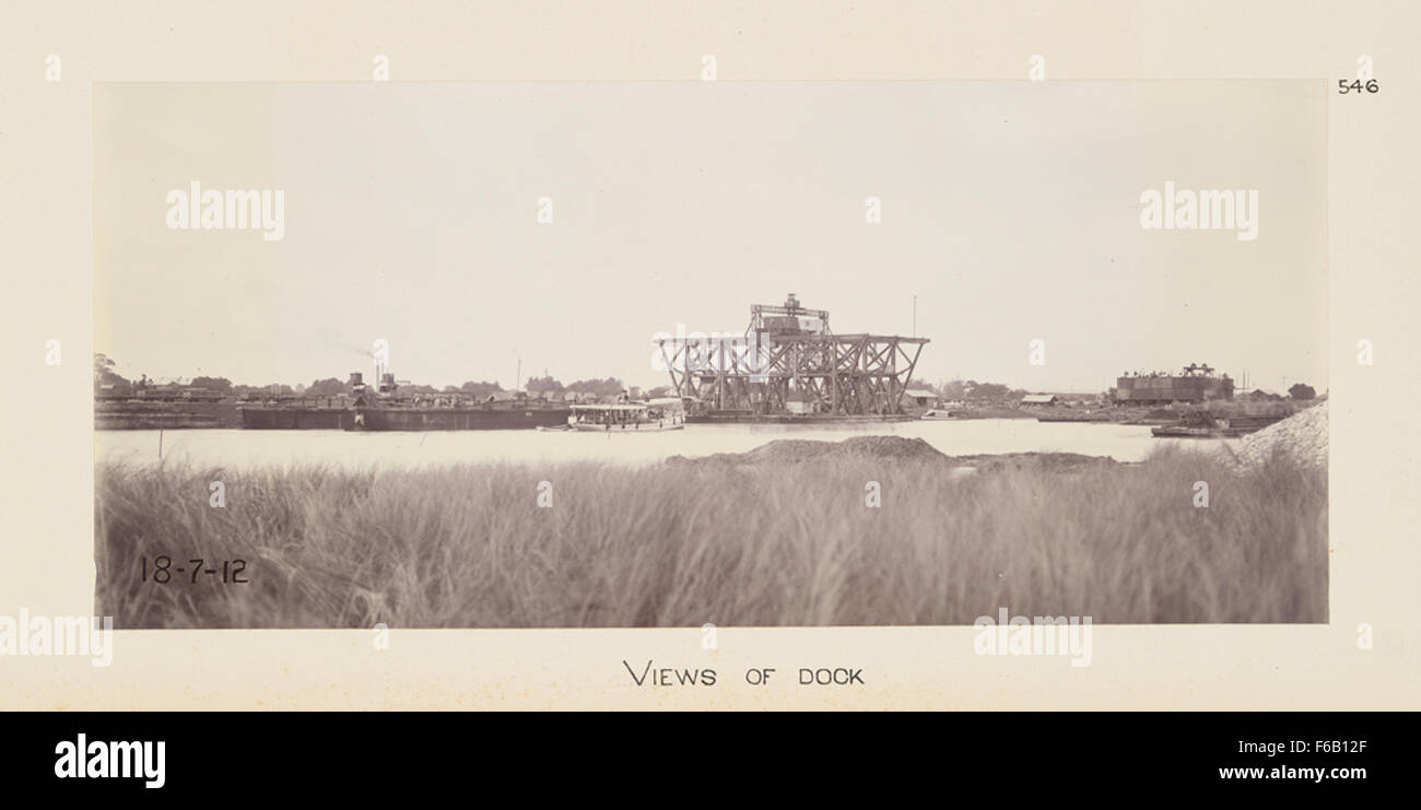 This photograph captures the construction of a dock bridge, part of the ...