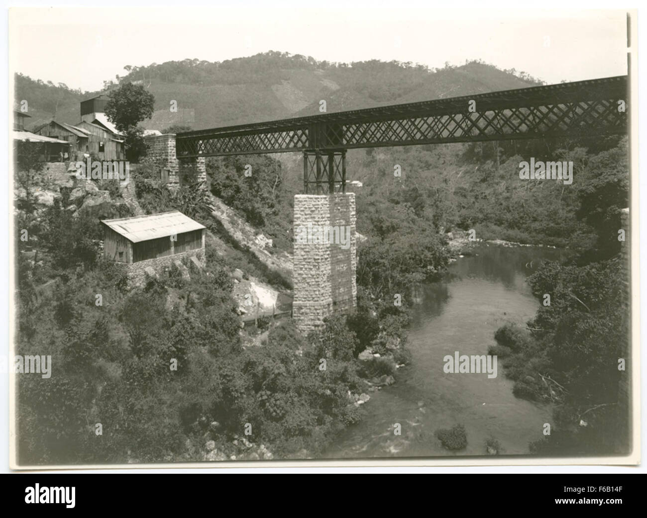 The image features a railroad bridge from the Ferrocarril Mexicano ...