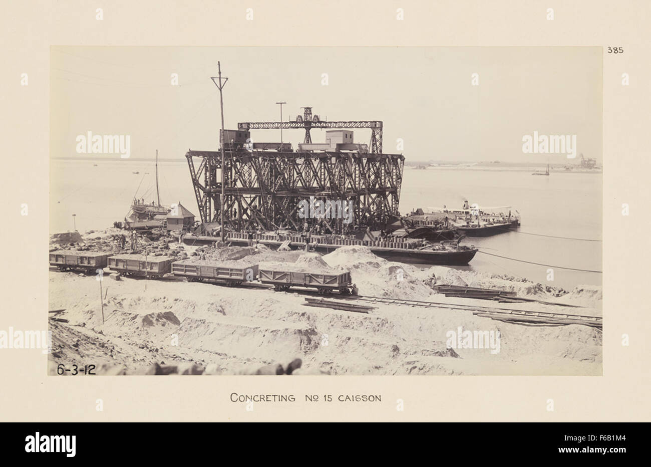 This image shows the construction of a railroad bridge using caisson ...