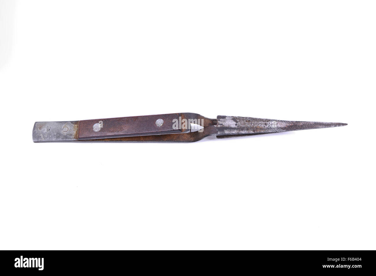 Old metal tweezers isolated on a white background Stock Photo - Alamy