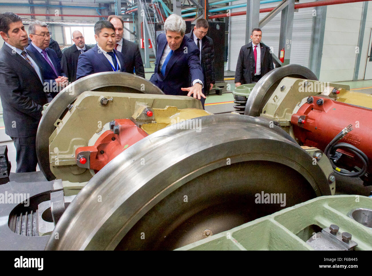 Secretary Kerry Looks at Wheel Assembly in Locomotive Plant Stock Photo ...