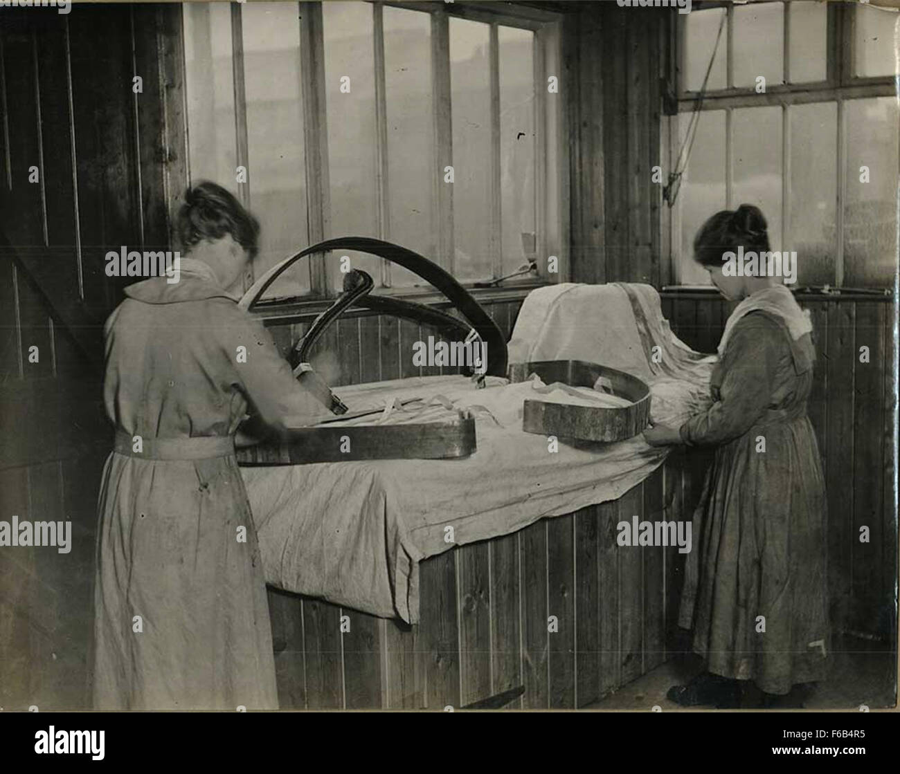 This historical image from the *1914-18* period illustrates *insulating ...