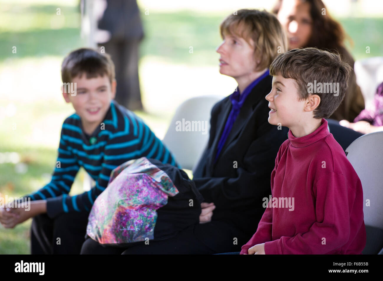 An audience member asks the panel a question at an event celebrating ...