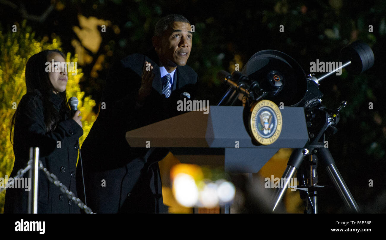 Agatha Sofia Alvarez-Bareiro, a student from Brooklyn, NY, left, points out parts of a telescope ...