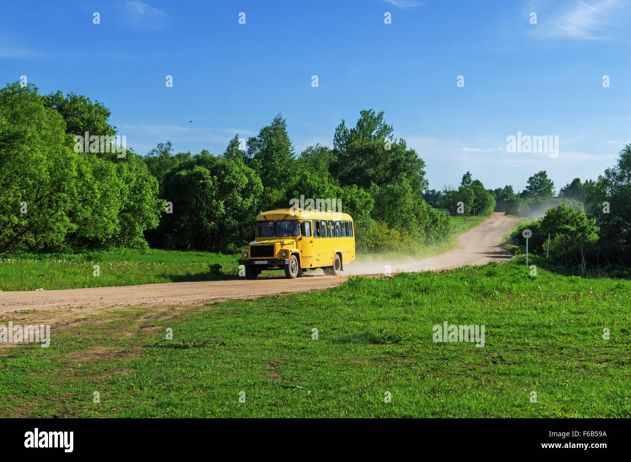 Rural road with yellow school bus Stock Photo - Alamy