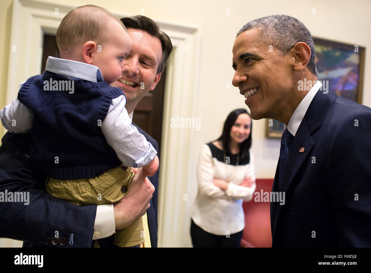 President Barack Obama greets Press Secretary Josh Earnest and his son ...