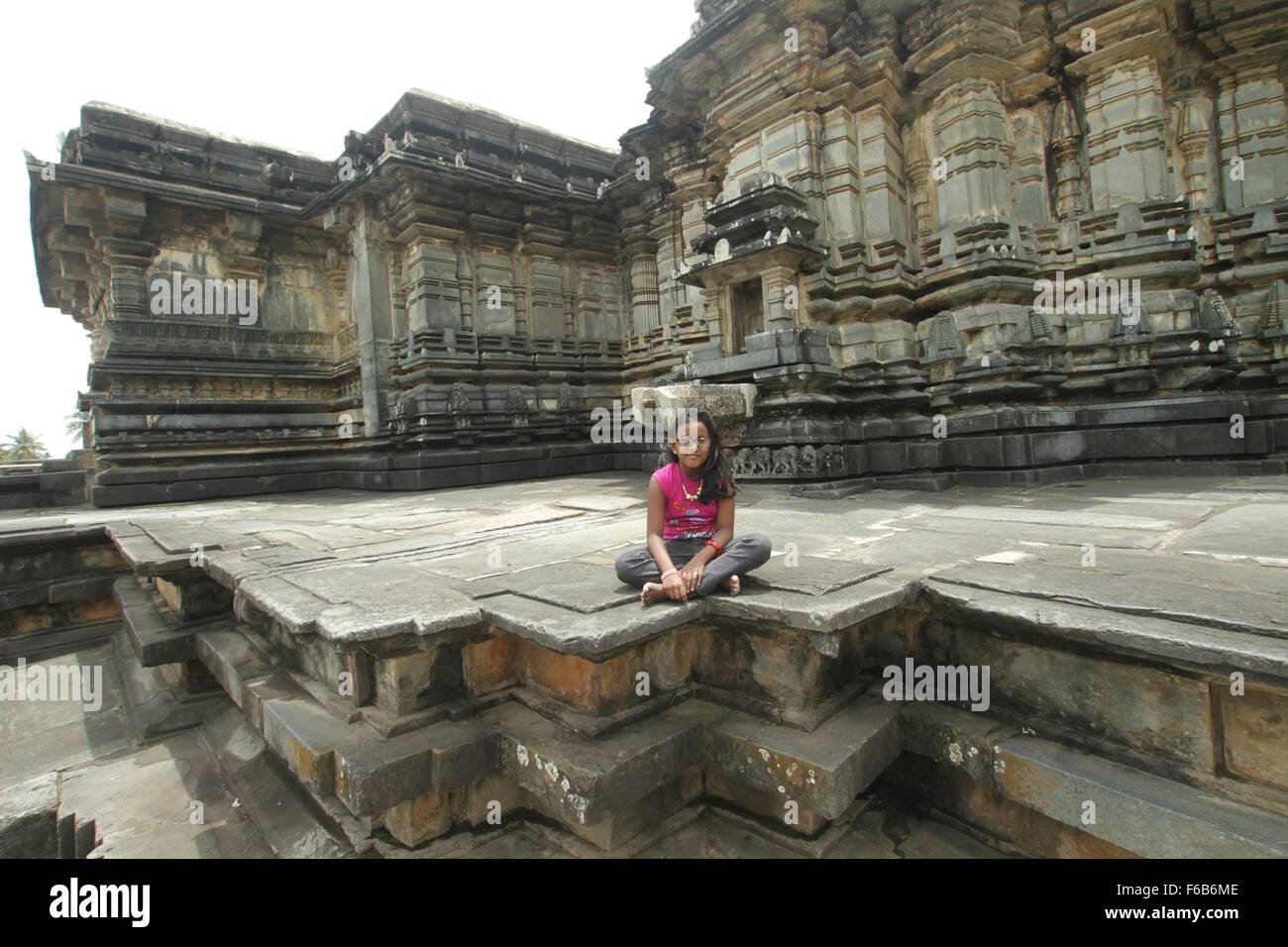 girl sitting in at ancient hindu temple in Belur Karnataka Stock Photo ...