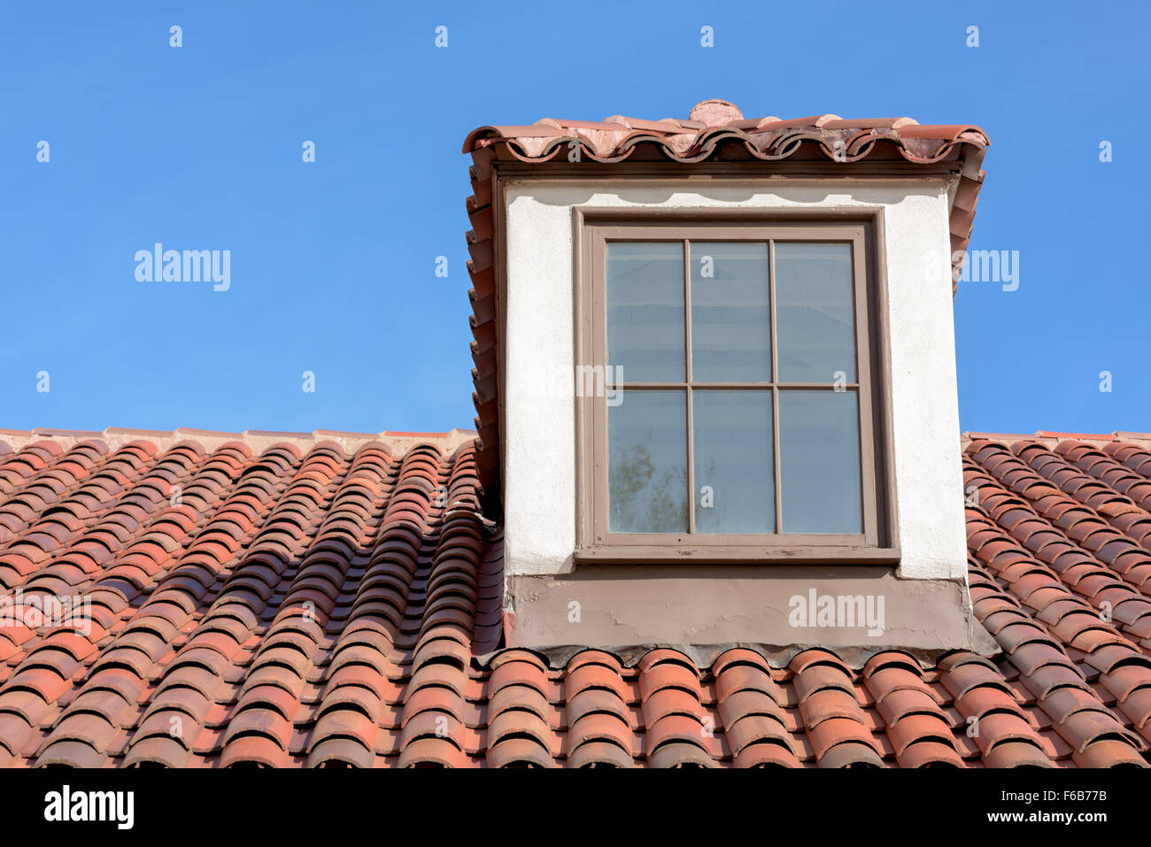 Classic red tile roof and window dormer Stock Photo - Alamy