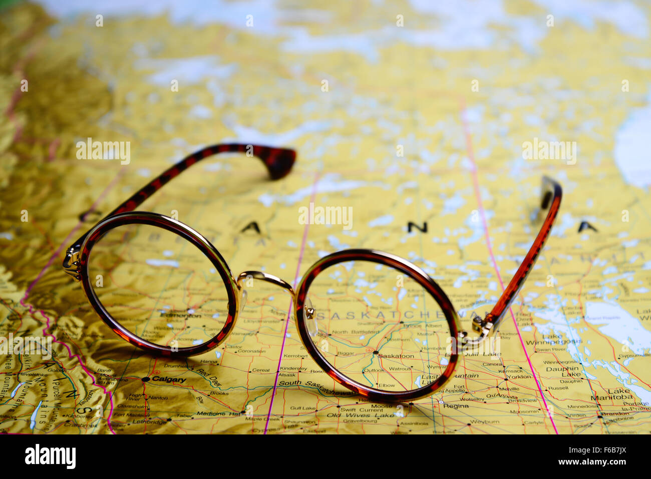 Glasses on a map - Canada Stock Photo - Alamy