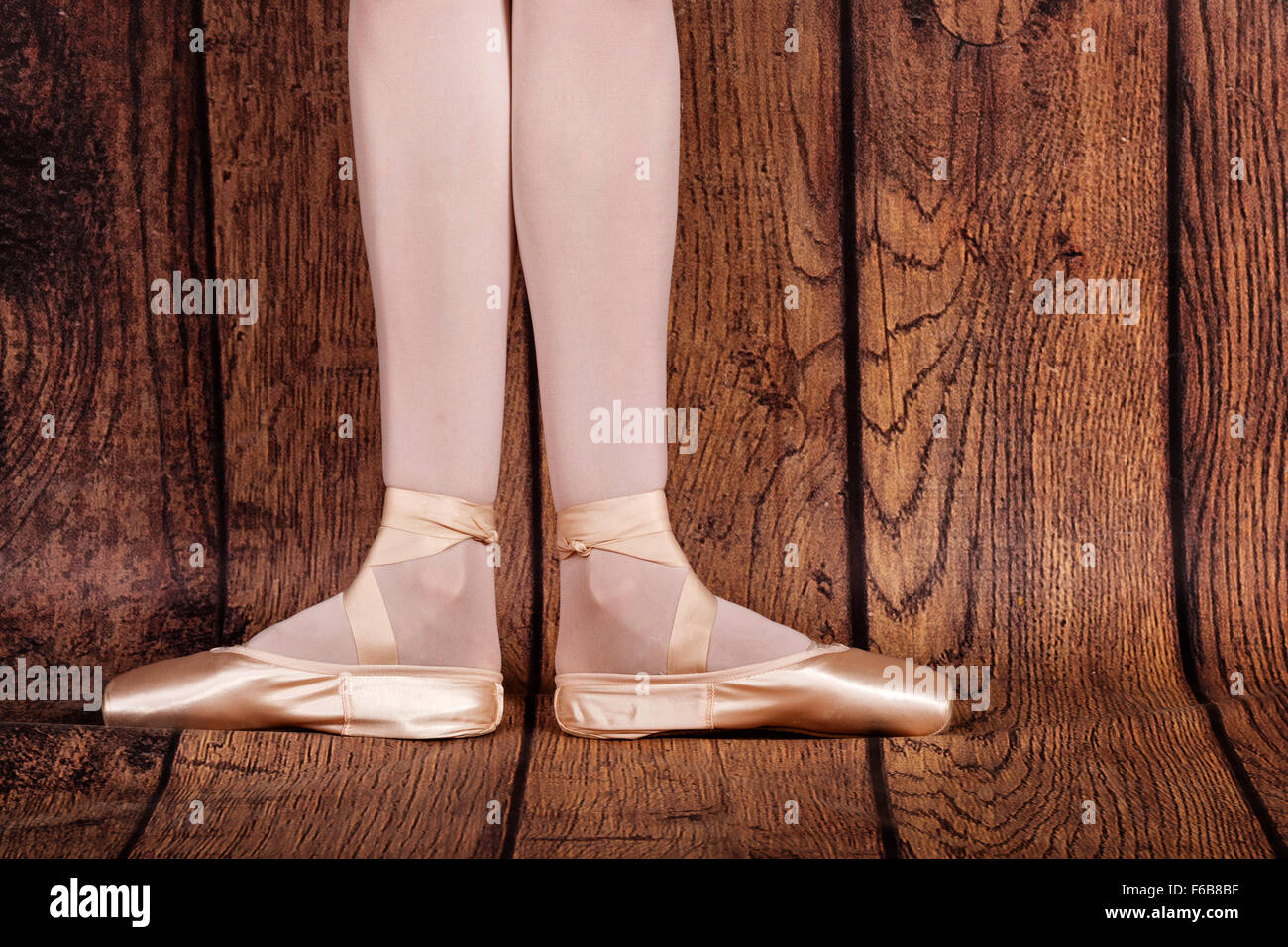 The first position in classical ballet. Slender legs of a ballerina in pointe shoes. Photo ...