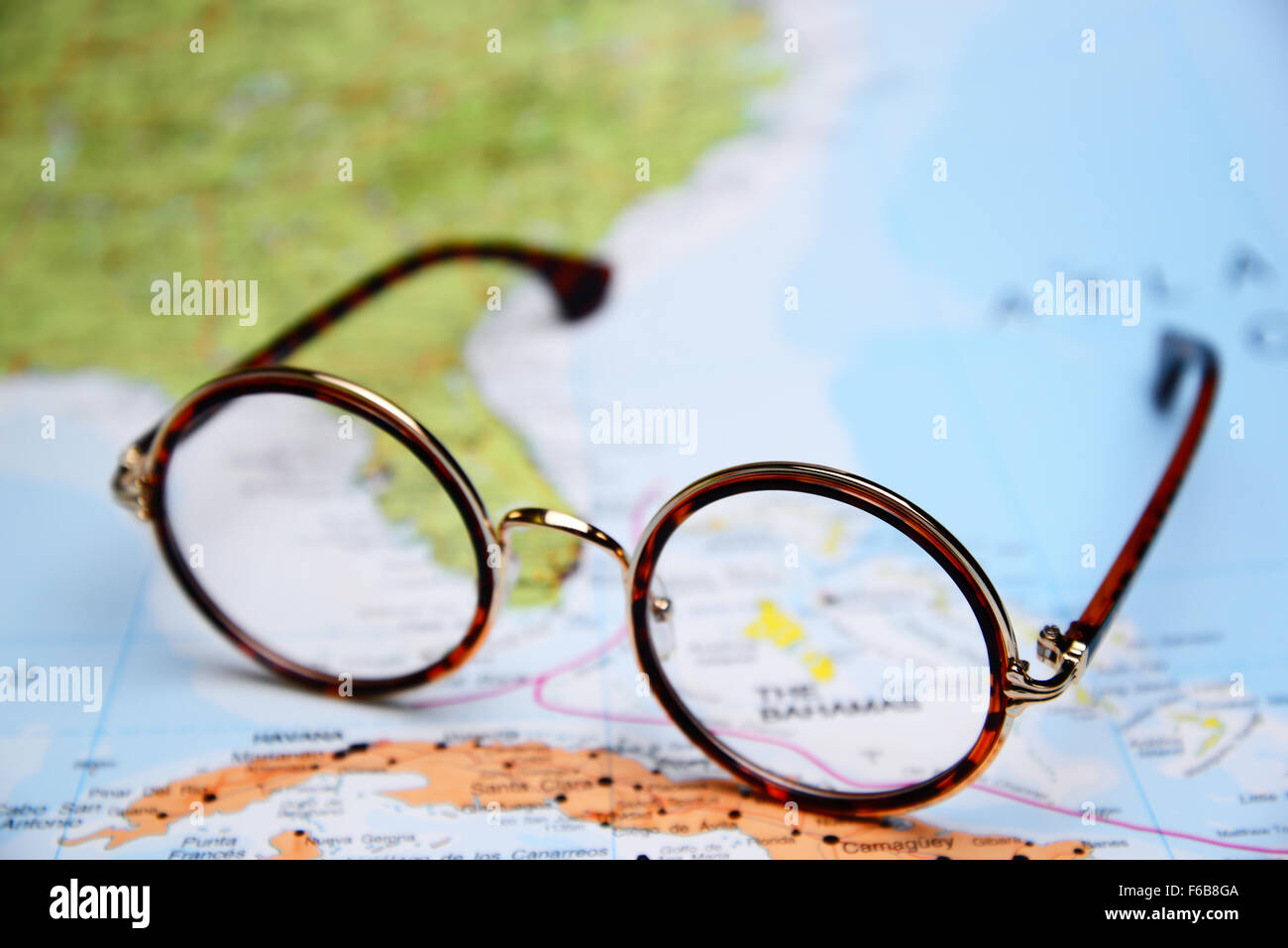 Glasses on a map - Bahamas Stock Photo - Alamy