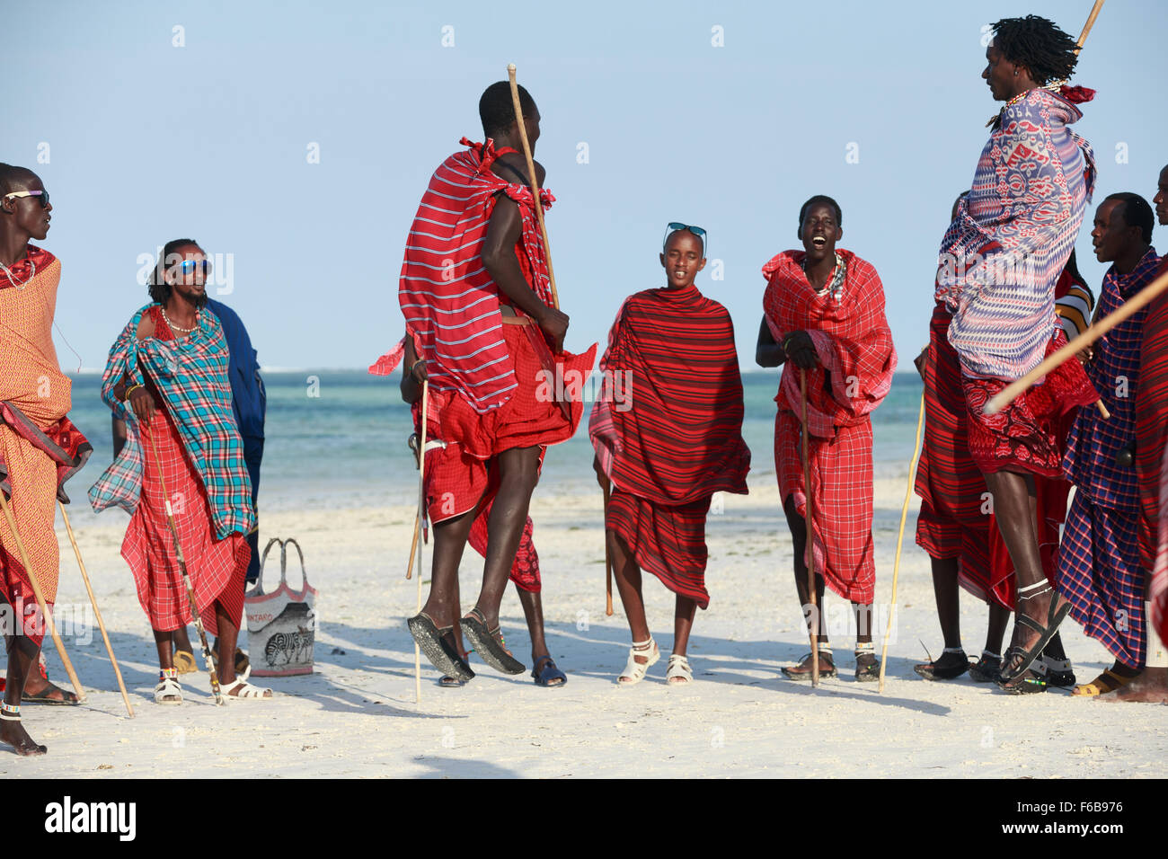 Tanzania Zanzibar Maasai men performing jumping dance on the beach ...