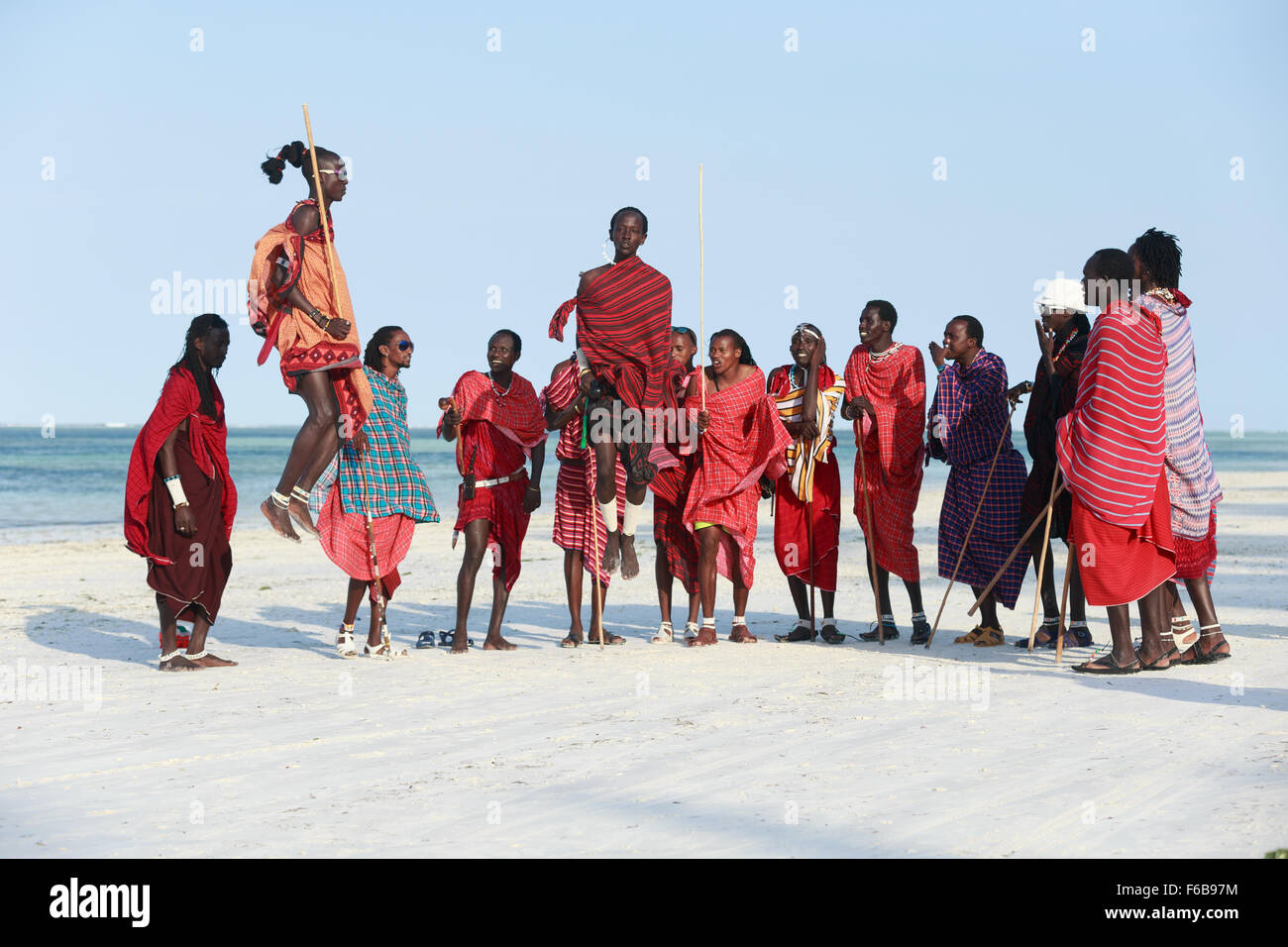 Tanzania Zanzibar Maasai men performing jumping dance on the beach ...