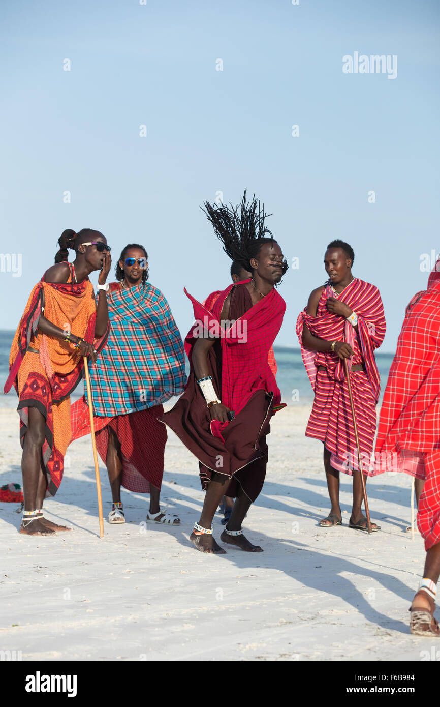Tanzania Zanzibar Maasai men performing jumping dance on the beach ...