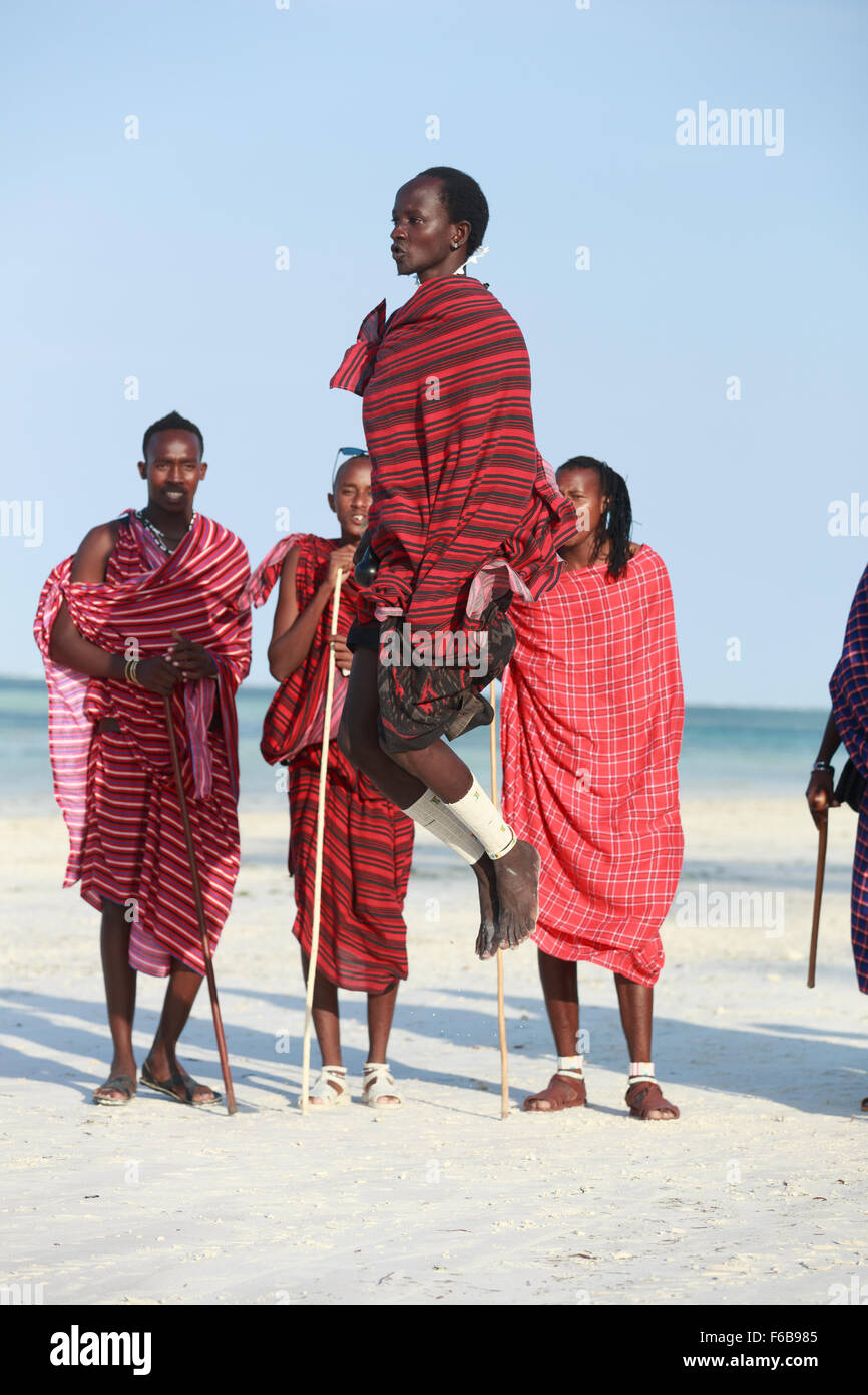 Tanzania Zanzibar Maasai men performing jumping dance on the beach ...
