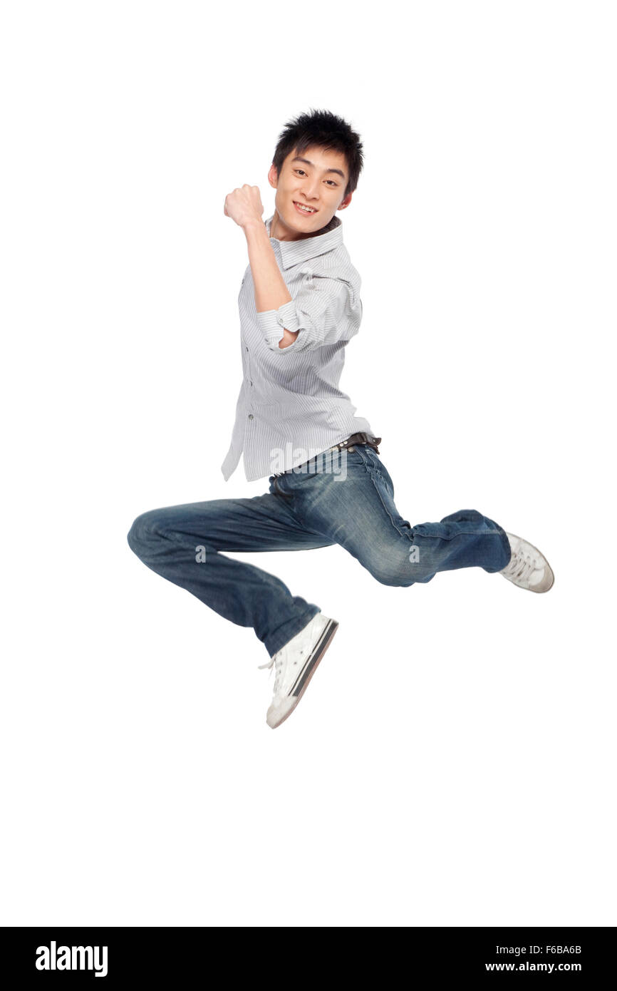 Portrait of a young man mid-air Stock Photo - Alamy