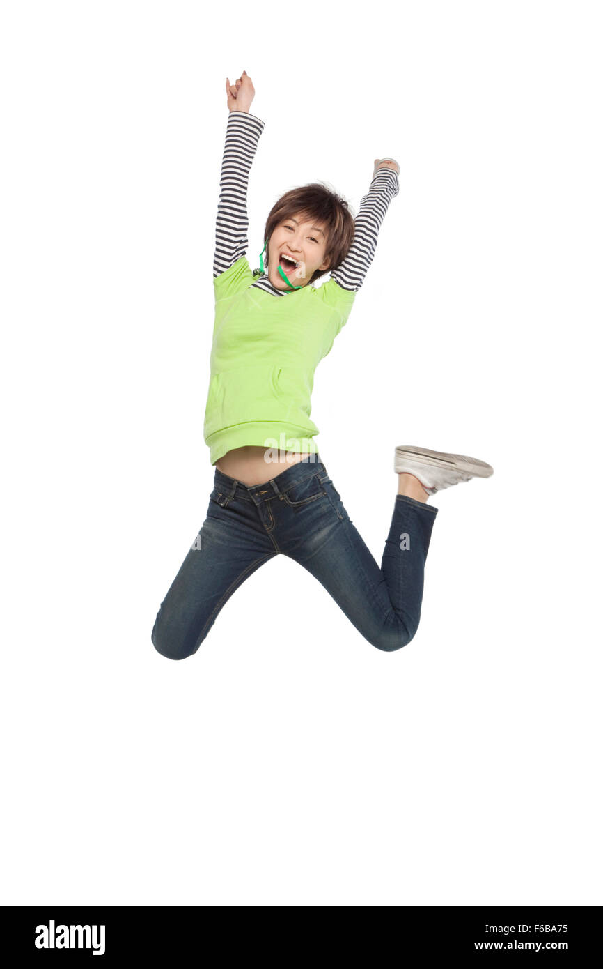 An excited woman jumping Stock Photo - Alamy