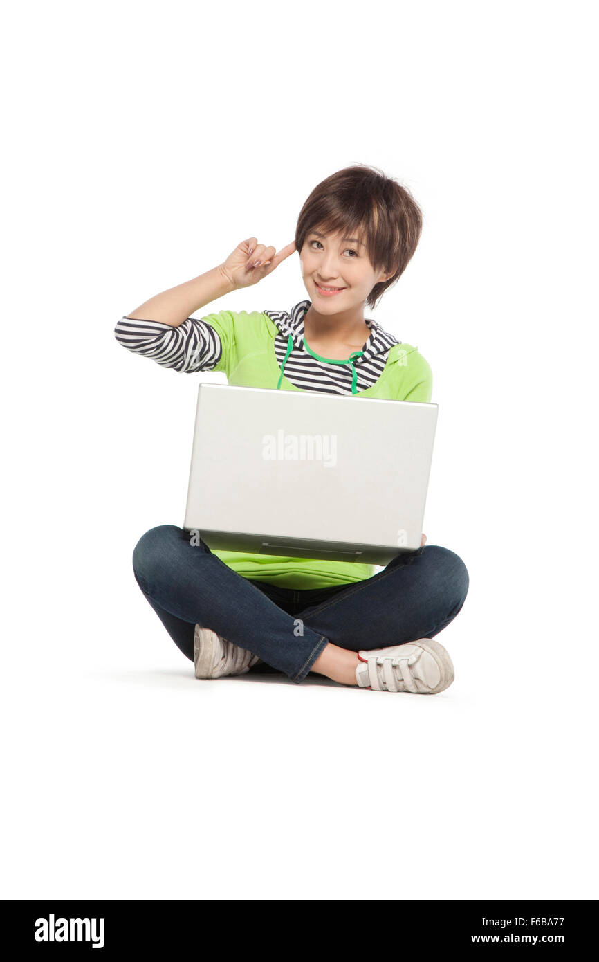 Young woman using a laptop computer Stock Photo - Alamy