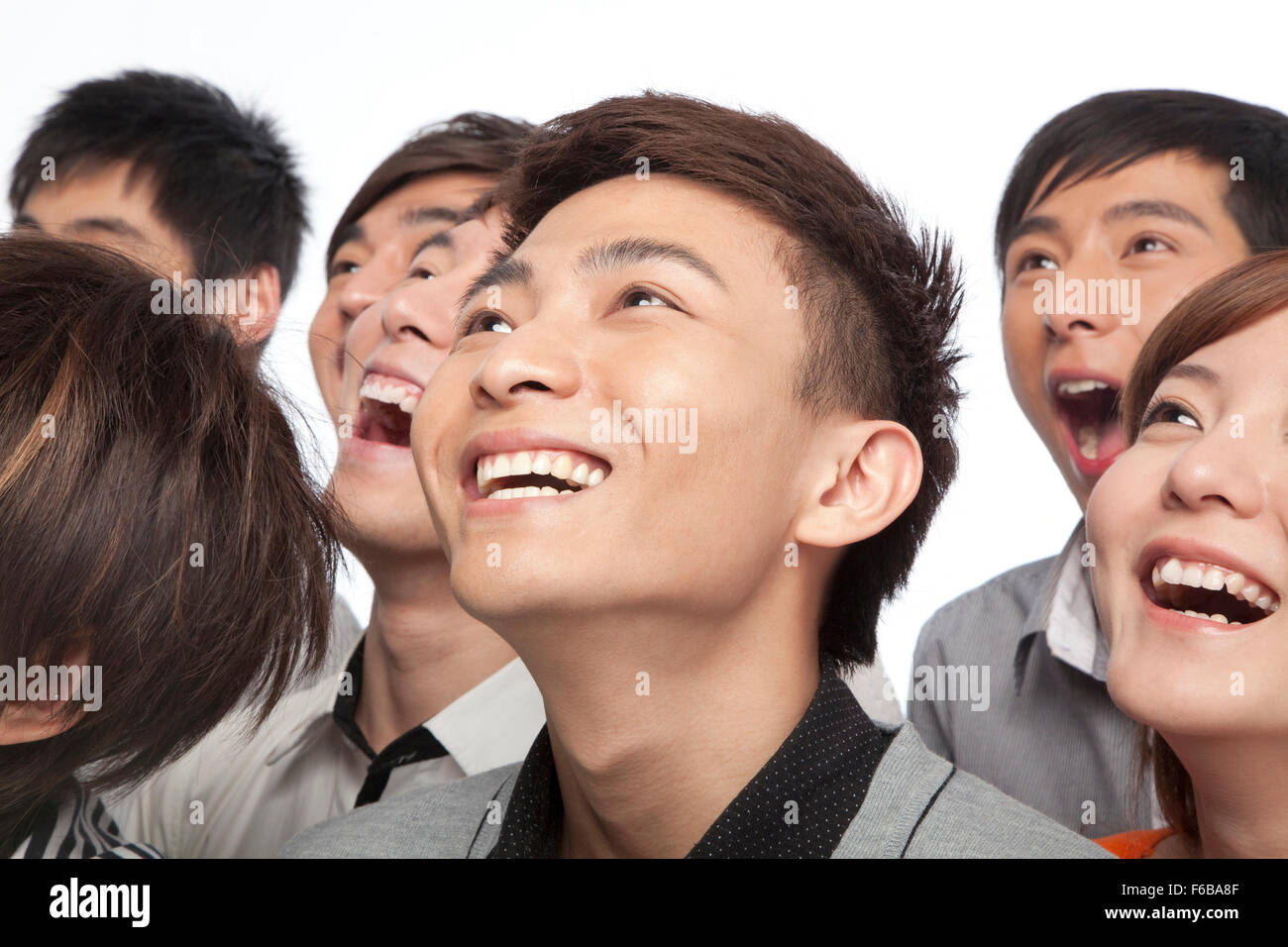 A group of young people looking up in excitement Stock Photo - Alamy