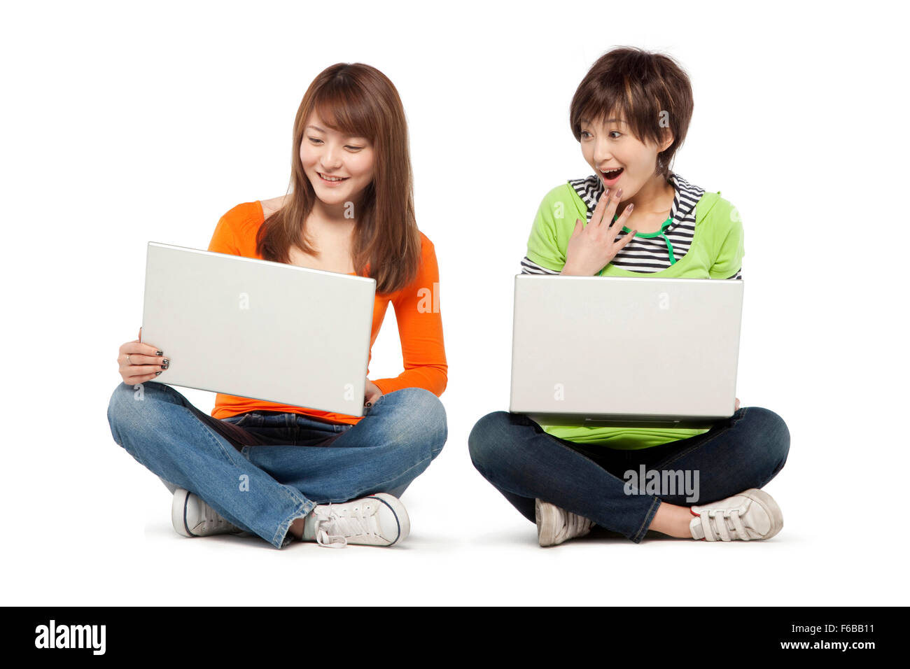 Two friends using laptop computers Stock Photo - Alamy