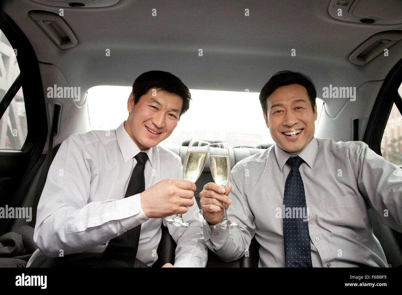 Face on two men in car hi-res stock photography and images - Alamy