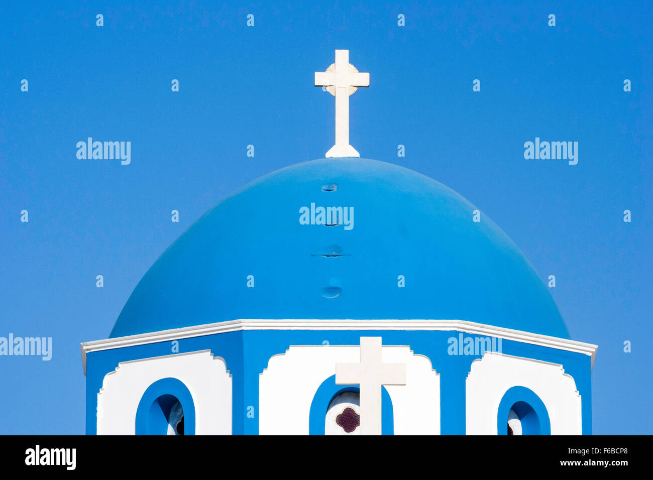 Santorini, Thira. White cross on top of blue cupola dome on top of ...